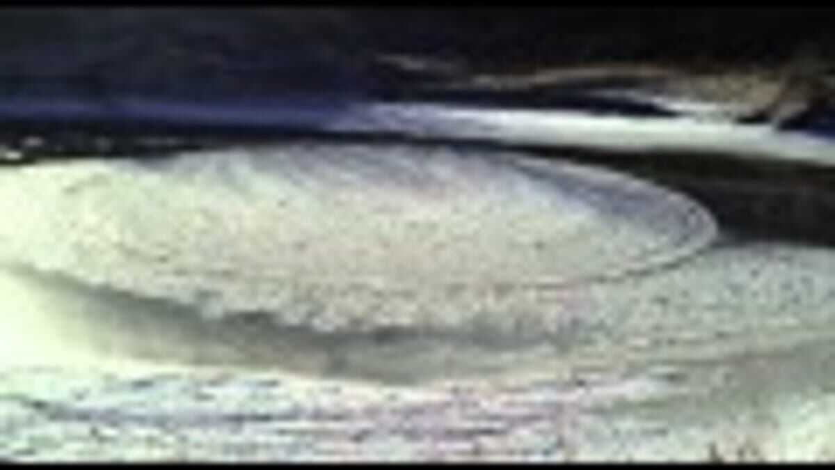 In a rare phenomenon, a huge ice disc spins in the Sheyenne River