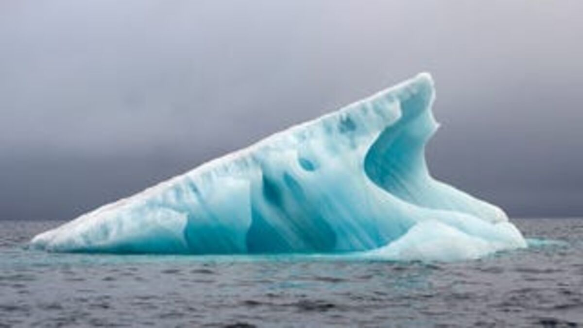 Iceberg Sighs Contentedly As It Slowly Lowers Itself Into Warm Arctic Water