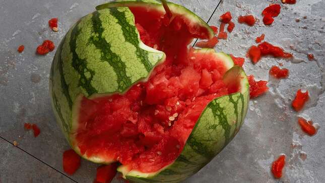 Guy discovers how many elastics it takes to blow up watermelon