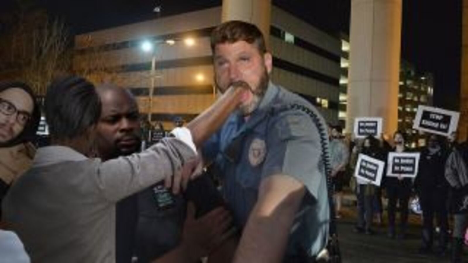 Wow: This Touching Photo Of A Cop Letting Protesters Warm Their Hands ...