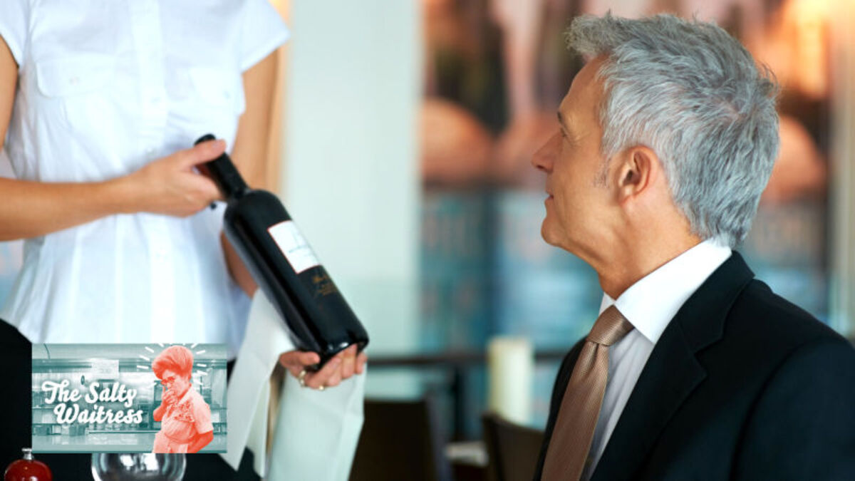 What do I do when a server presents my wine?